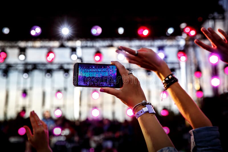 Using a Mobile Phone at a Summer Music Show Stock Image - Image of ...