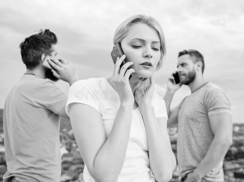 Using The Mobile Technology While On The Move Group Of Friends Talk On