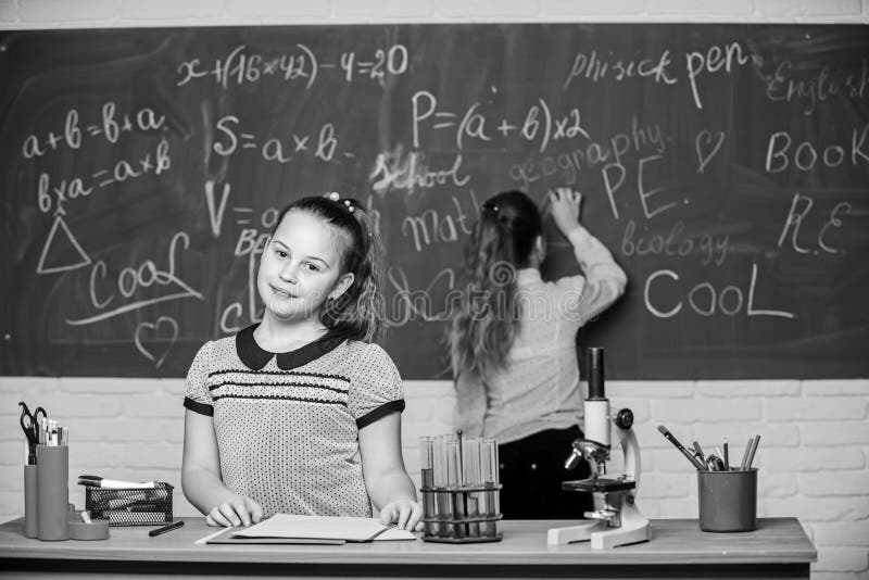 Using Modern Technologies. Little Girls Scientist Work with Microscope ...