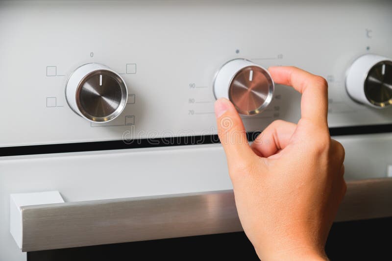 Using an Oven, Close-up of Oven Temperature Control. a Woman& X27;s ...