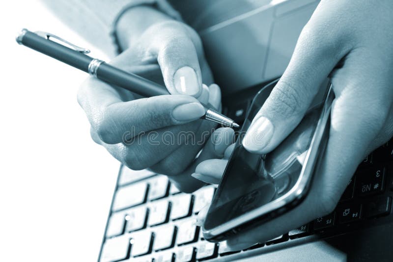 Using a PDA mobile phone stock photo. Image of laptop - 16762606
