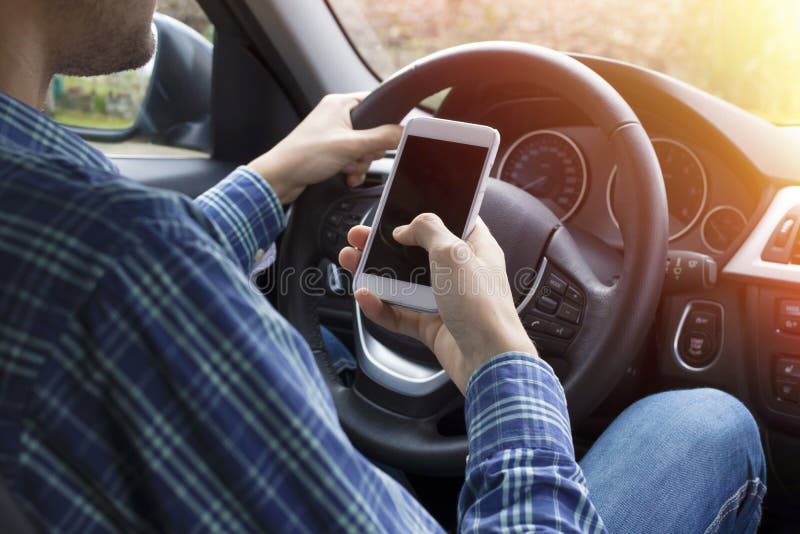 Using phone while driving stock photo. Image of looking - 135189322