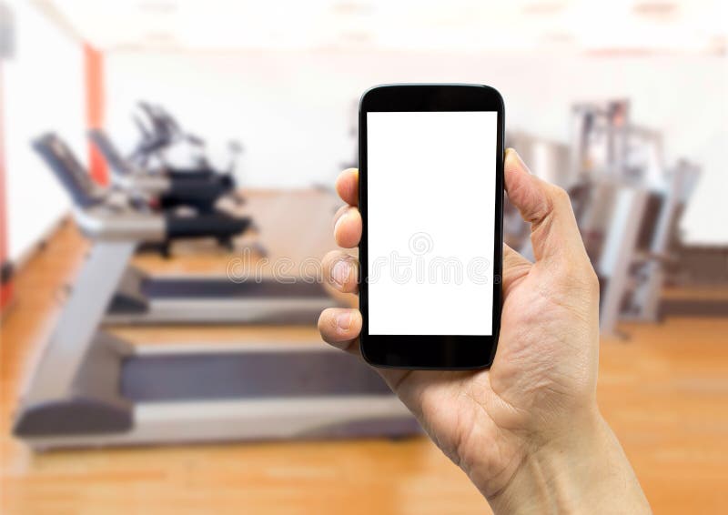 Using the phone at gym stock photo. Image of information - 65671228
