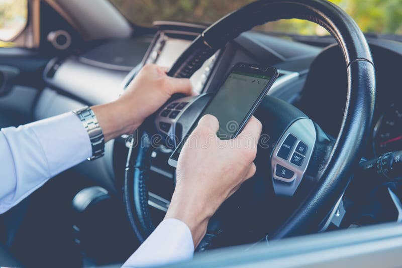 Text SMS while Driving stock image. Image of cellphone - 11619991