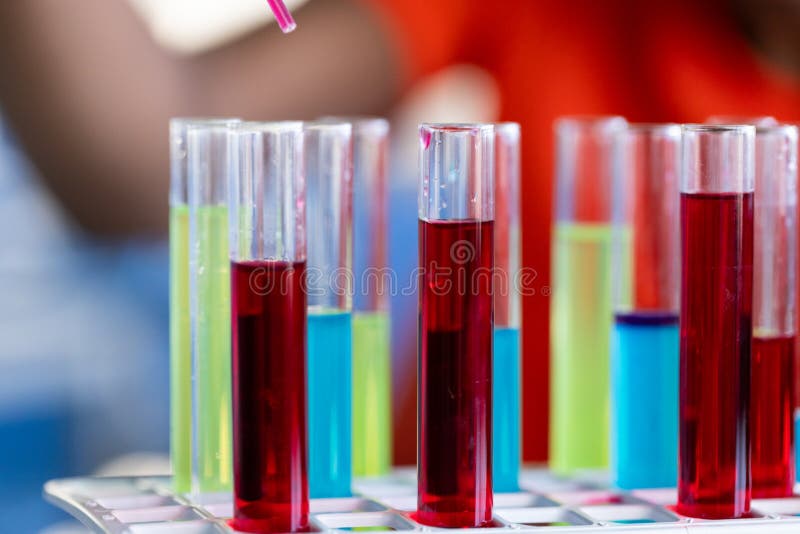 Using Pipette with Colorful Liquids, Student Conducting Science ...