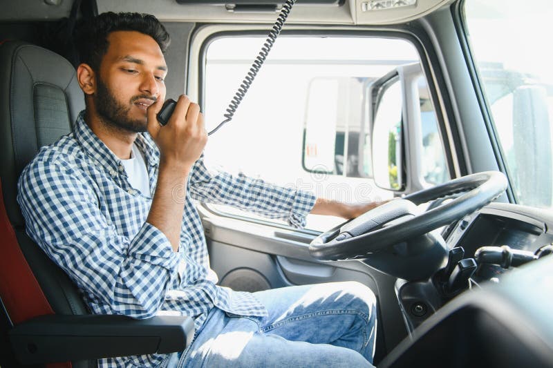 Using Radio. Young Truck Driver is with His Vehicle at Daytime. Stock ...