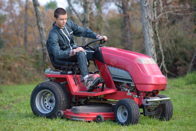 Man on ride on mower stock photo. Image of gardening - 115128390