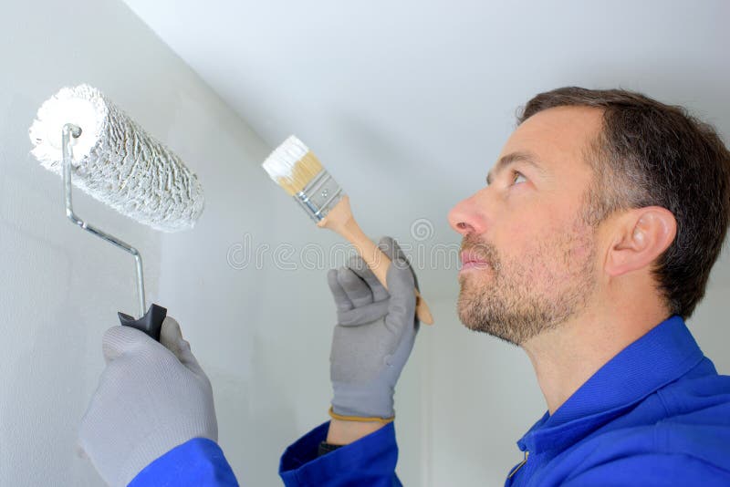 Using roller to paint wall stock image. Image of paint - 89547301