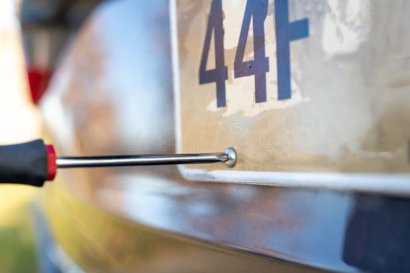 Using a Driver To Remove and Replace a Vehicle Rear License Plate ...