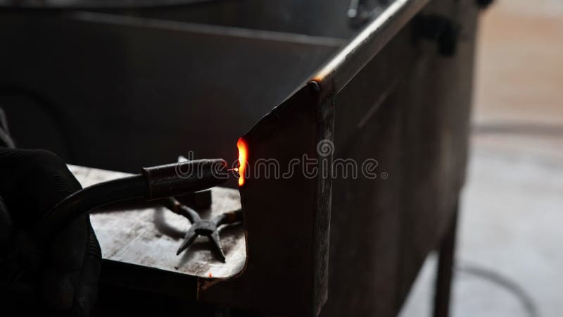 Using a Semiautomatic Argon Gas Shielded Welding Machine, a Worker ...