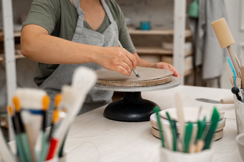 Using a Sharp Pottery Carving Knife To Cut Out a Perfect Round Shape ...