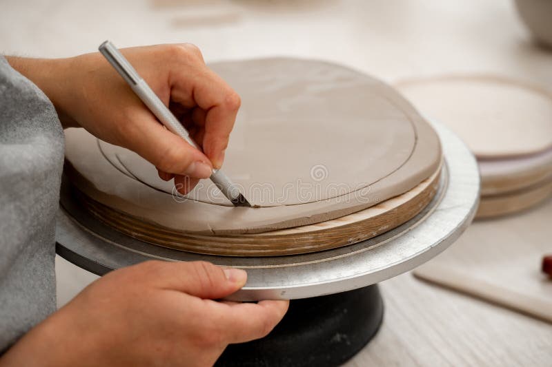 Using a Sharp Pottery Carving Knife To Cut Out a Perfect Round Shape ...
