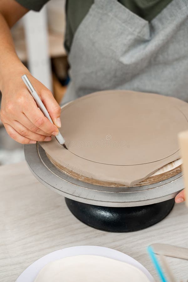 Using a Sharp Pottery Carving Knife To Cut Out a Perfect Round Shape ...