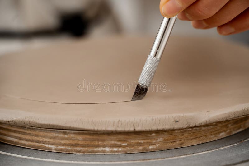 Using a Sharp Pottery Carving Knife To Cut Out a Perfect Round Shape ...