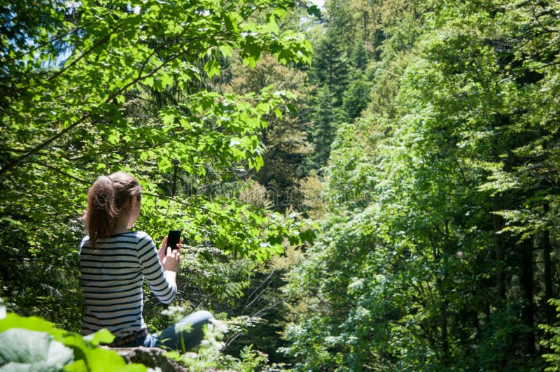 Using a Smart Phone in Nature Stock Photo - Image of country, contacts ...