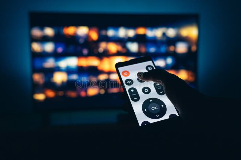 Using a Smartphone As Remote Control Stock Photo - Image of broadcast ...