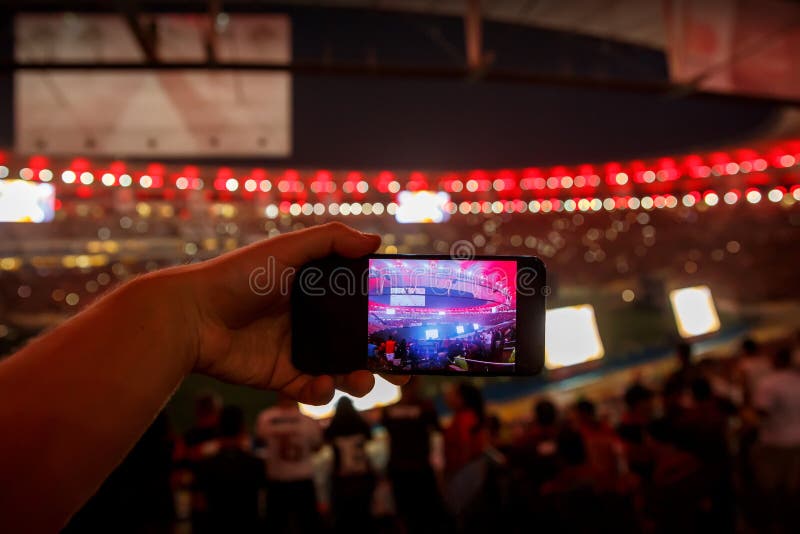 Using Smartphone on a Big Sport Stadium Stock Photo - Image of media ...