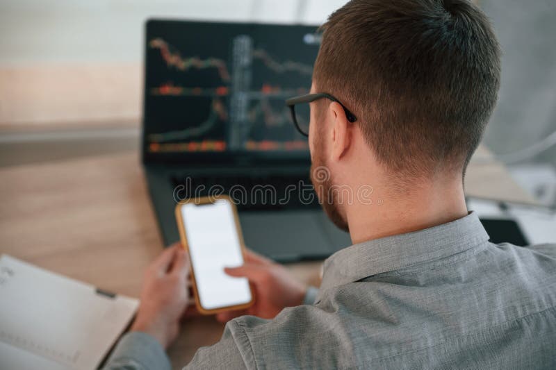 Using Smartphone. Businessman in Formal Clothes is Working in the ...