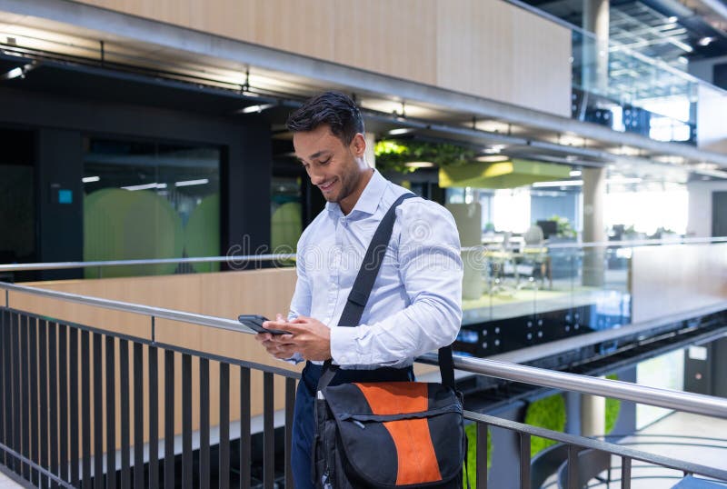 Using Smartphone, Businessman with Shoulder Bag Standing in Modern ...