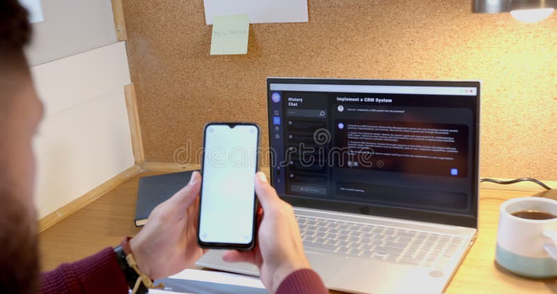 Using Smartphone and Laptop for AI Chatbot, Man Working from Home at ...