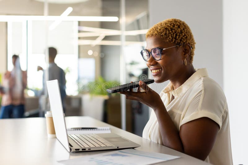 Using Smartphone for Voice Command, Woman Working on Laptop in Modern ...