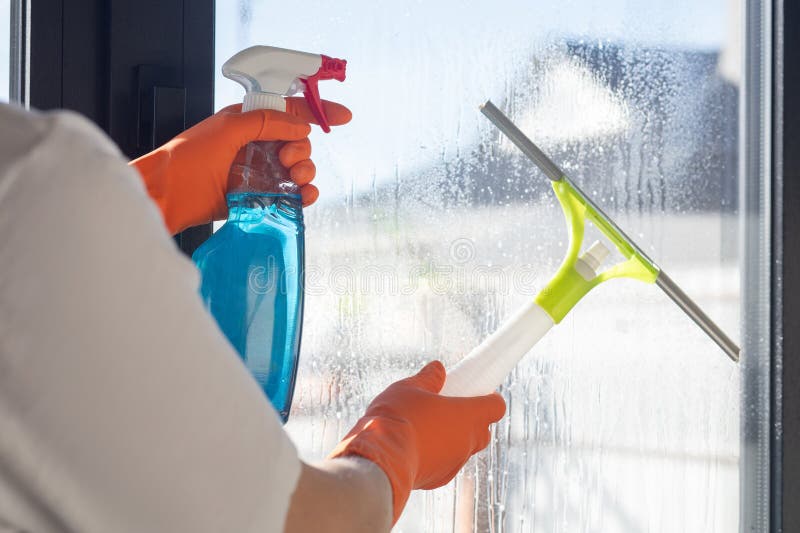 Using a Special Squeegee and Cleaner To Clean Windows Stock Photo ...