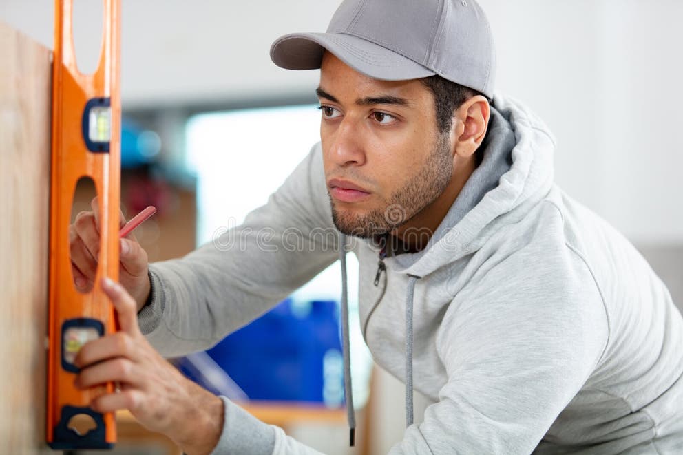 Using Spirit Level To Check Wall Straight Stock Image - Image of square ...