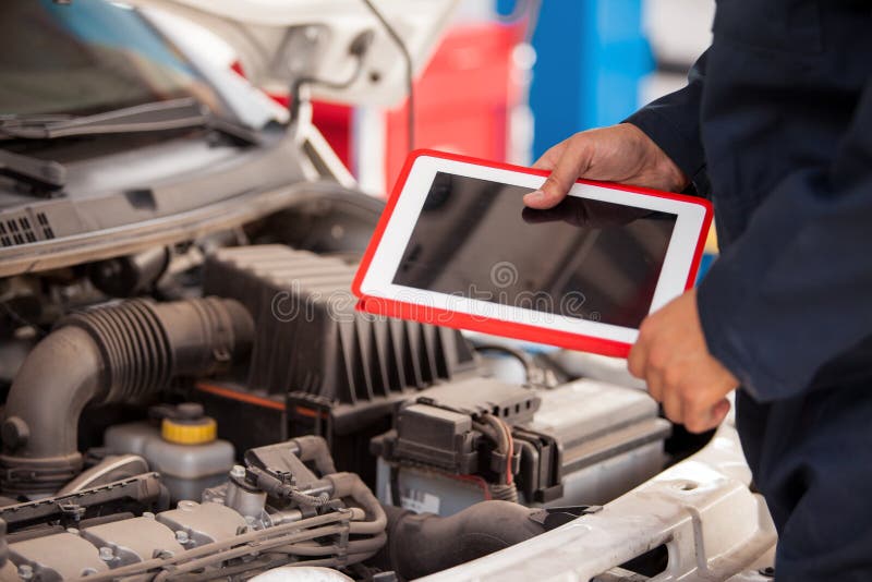 Using Tablet Computer in Auto Shop Stock Photo - Image of ...