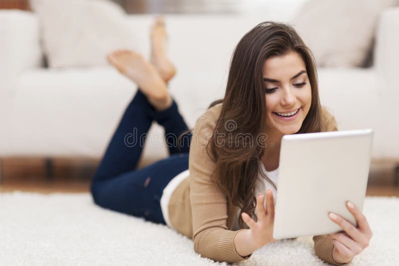Using tablet at home stock image. Image of living, examining - 38445515