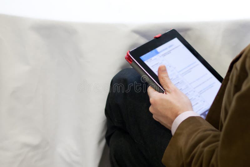 Using a tablet pc stock image. Image of keyboard, room - 27430345