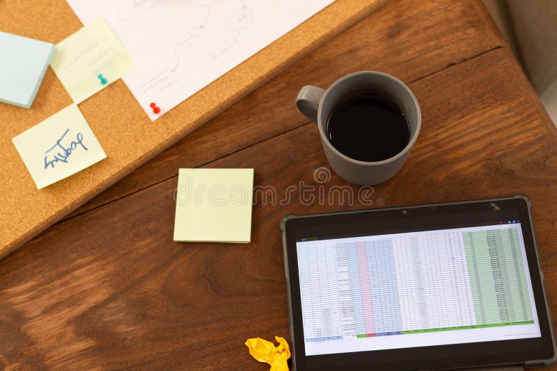 Using Tablet with Spreadsheet, Person Working at Desk with Coffee and ...