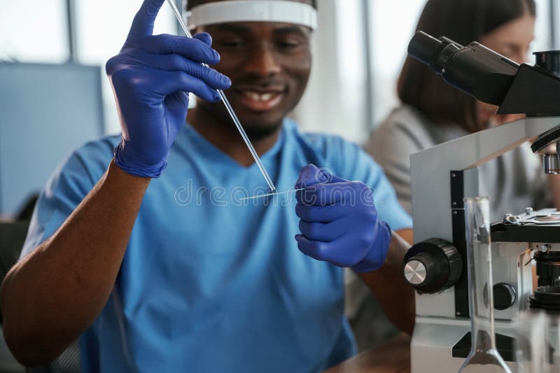 Using Test Tubes. Group of Doctors are Together Indoors Stock ...