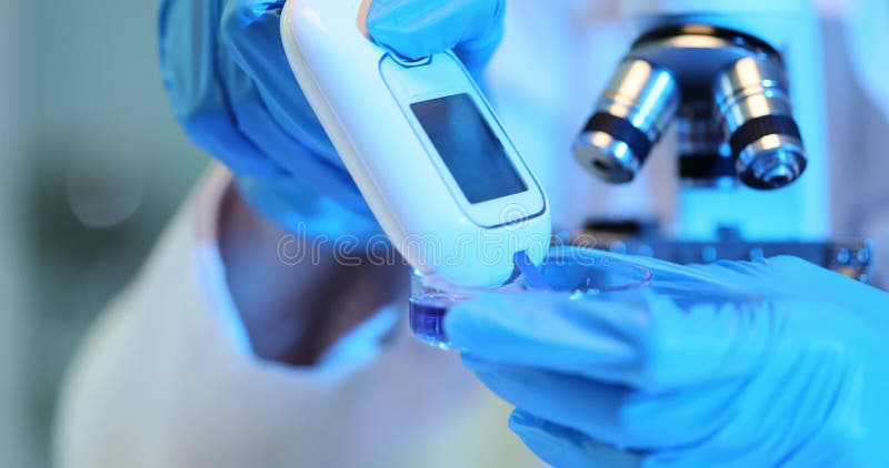 Using Tester To Measure Liquid Analysis in Laboratory Stock Video ...