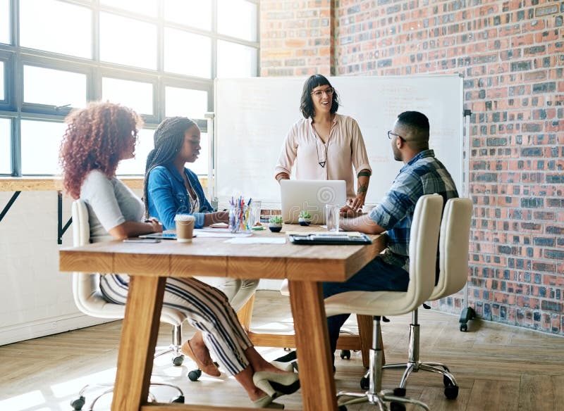 Using Their Resources Wisely. a Businesswoman Giving a Presentation in ...