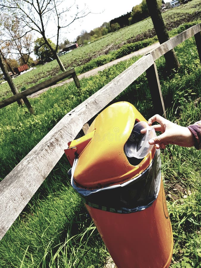 Using trashcan stock image. Image of trash, bodypart - 70750299