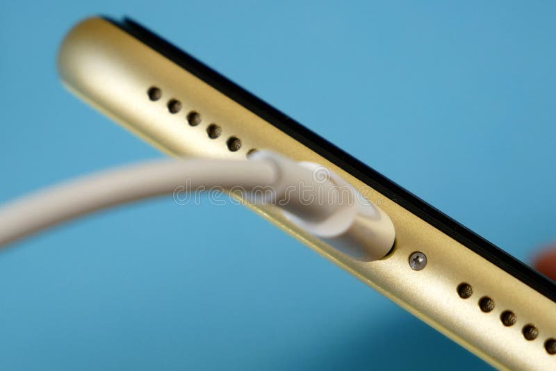 Using USB TYPE C Port Cable for Mobile Phone Charger on Blue Background ...