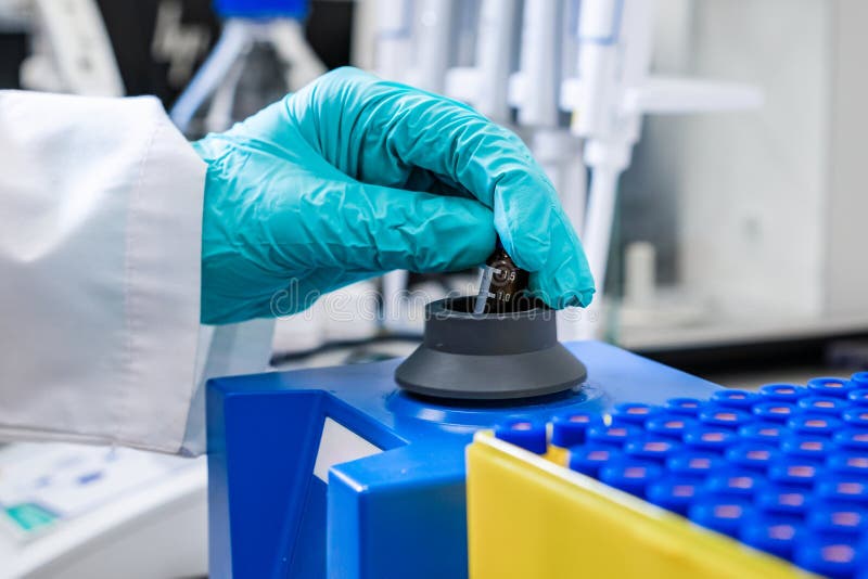 Using a Vortex Mixer, a Chemist Agitates Samples before Conducting HPLC ...