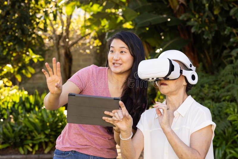 Using VR Headset, Asian Grandmother Exploring Virtual Reality with ...