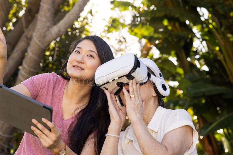 Using VR Headset, Asian Grandmother Exploring Virtual Reality with ...