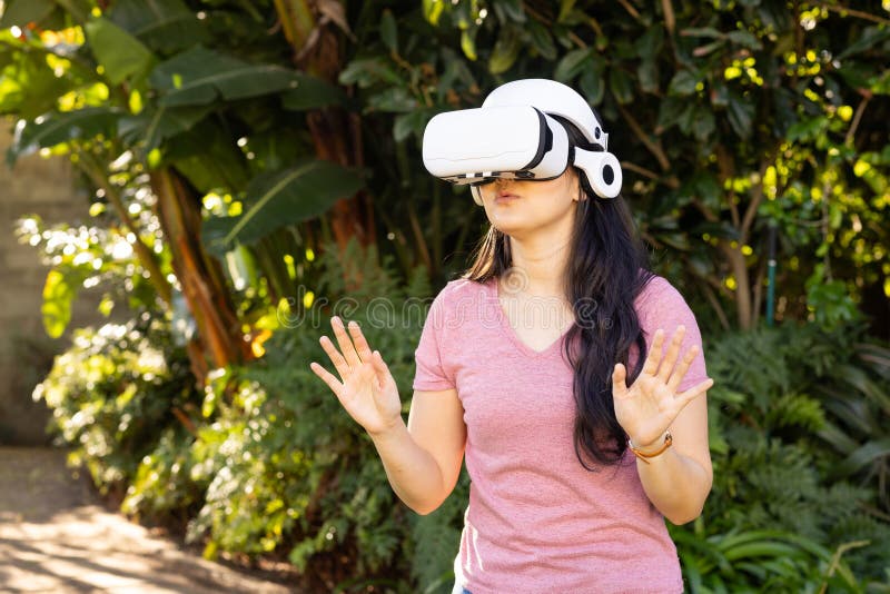 Using VR Headset, Asian Woman Exploring Virtual Reality Outdoors in ...