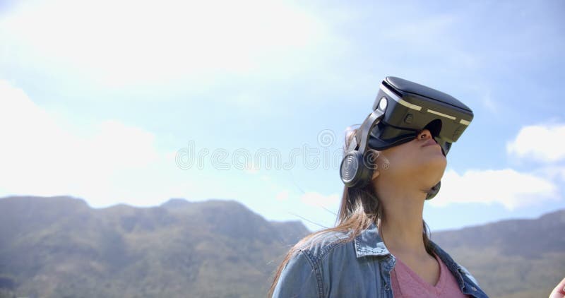 Using VR Headset, Asian Woman Exploring Virtual Reality Outdoors in ...
