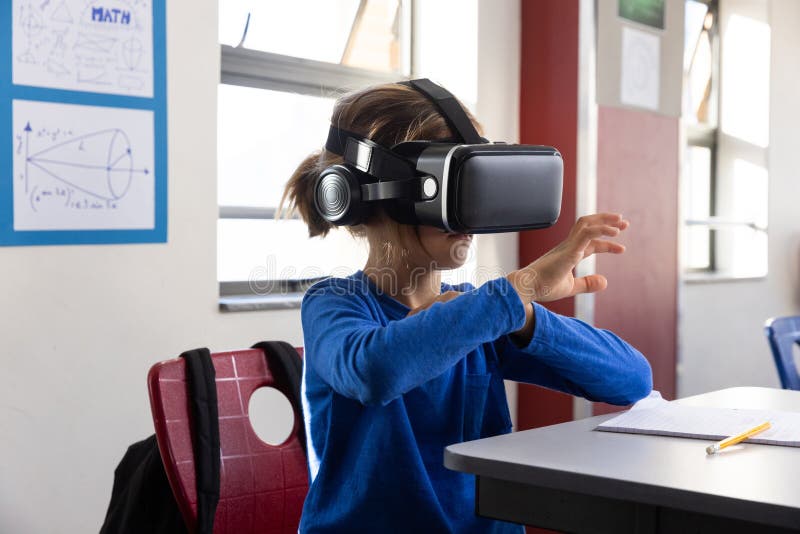 Using VR Headset, Boy Interacting with Virtual Environment in School ...