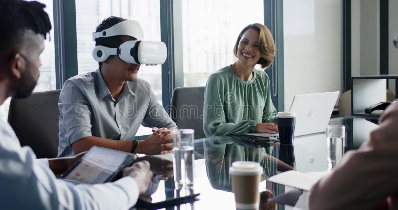 Using VR Headset, Man in Business Meeting with Colleagues in Modern ...