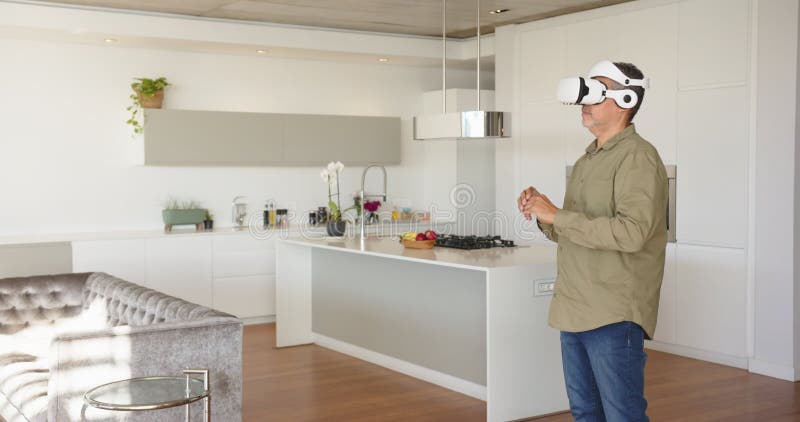 Using VR Headset, Man Exploring Virtual Reality in Modern Kitchen, at ...