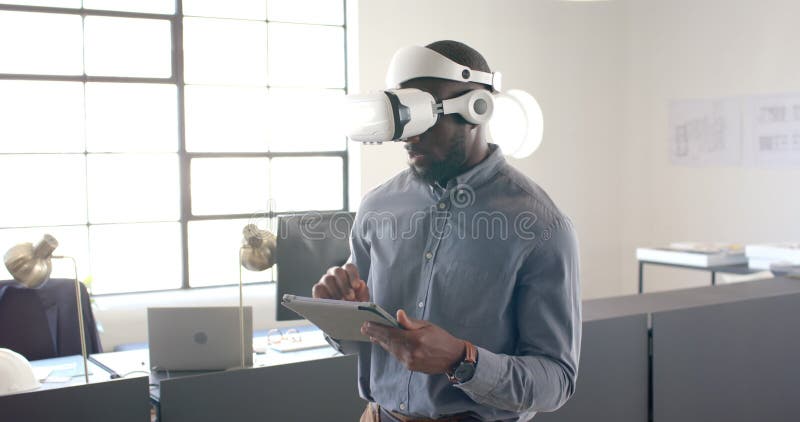 Using VR Headset, Man Working on Tablet in Modern Office Environment ...