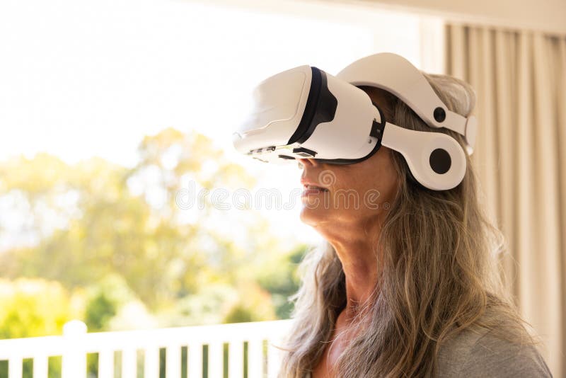 Using VR Headset, Mature Woman Exploring Virtual Reality at Home Stock ...