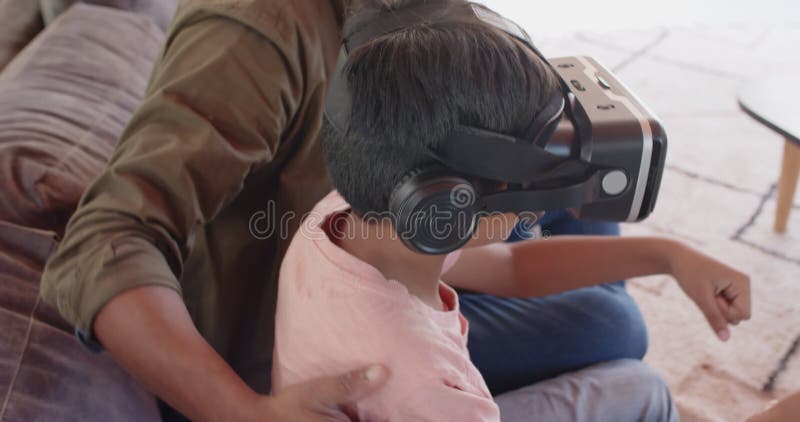 Using VR Headset, Young Boy Sitting with Indian Father on Couch ...