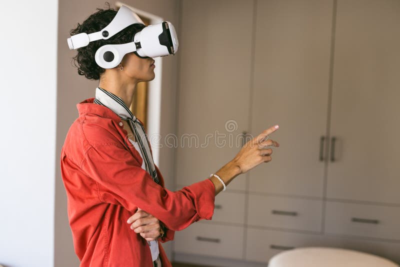 Using VR Headset, Young Man Pointing and Interacting with Virtual ...