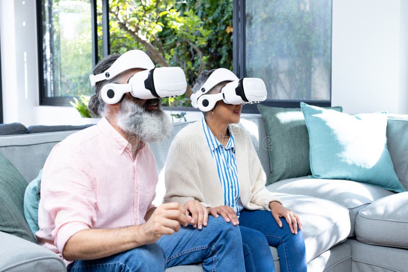 Using VR Headsets, Senior Couple Exploring Virtual Reality while ...