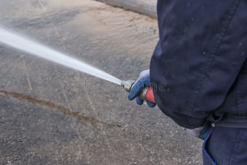 Using Water Hose To Clean Road Stock Photo - Image of nozzle, tube ...